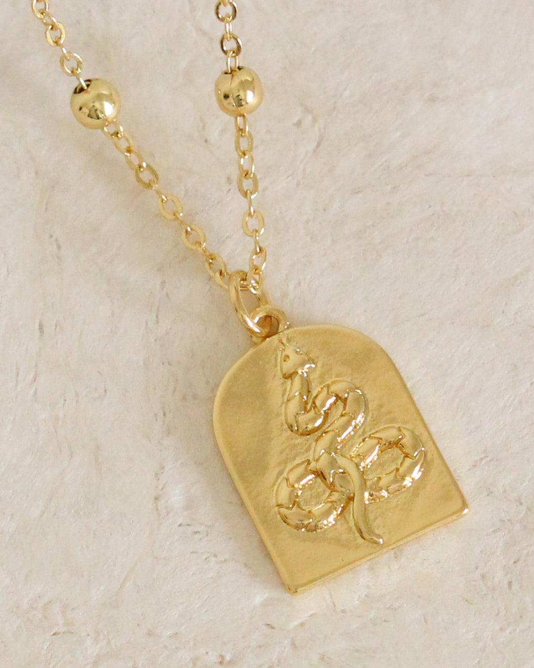 Collar Arco Serpiente – PINK REVOLVER